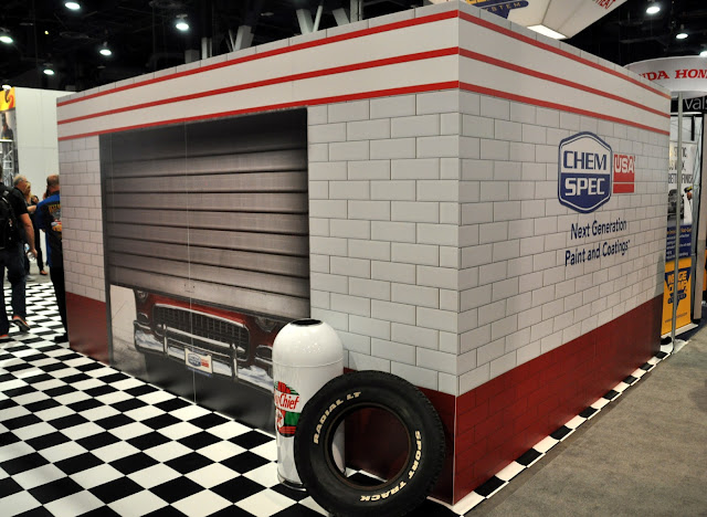 Just A Car Guy: making a booth look like a garage is a common theme at ...
