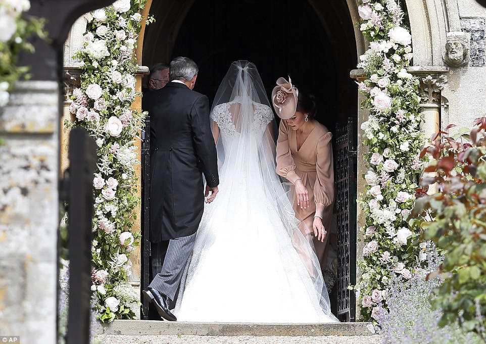 Kate Middleton stays low-key in peach at Pippa's wedding