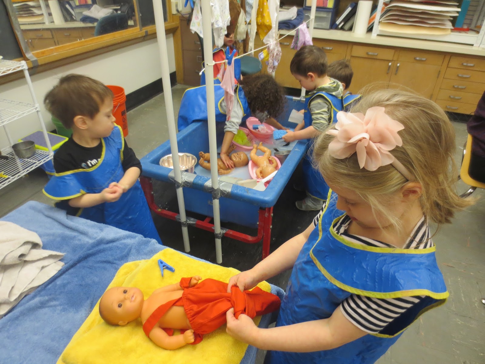 SAND AND WATER TABLES: Baby washing 2016