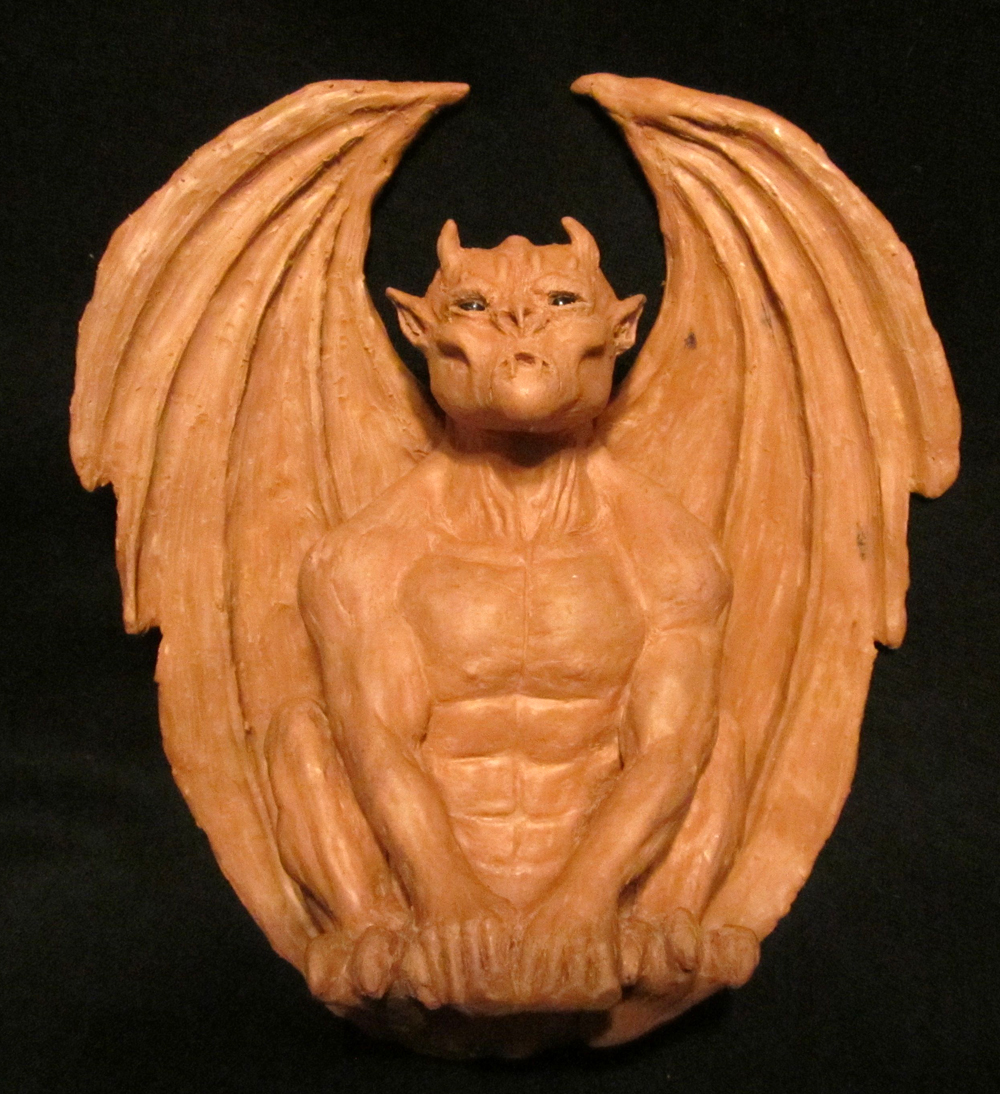 Bronze gargoyle door knocker: Gargoyle wing's receive their clay; ready ...