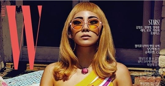 CL poses poolside for the cover of 'W' magazine