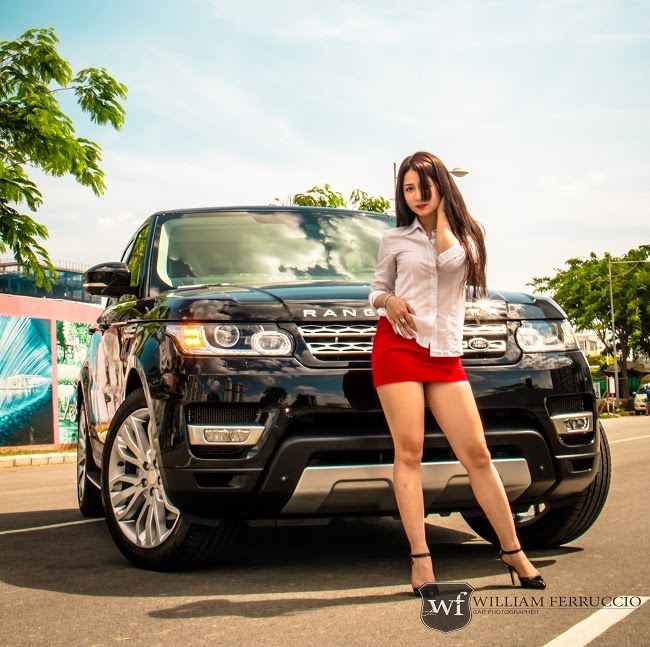 Rebellion office girl poses with Range Rover Sport | Carsfresh