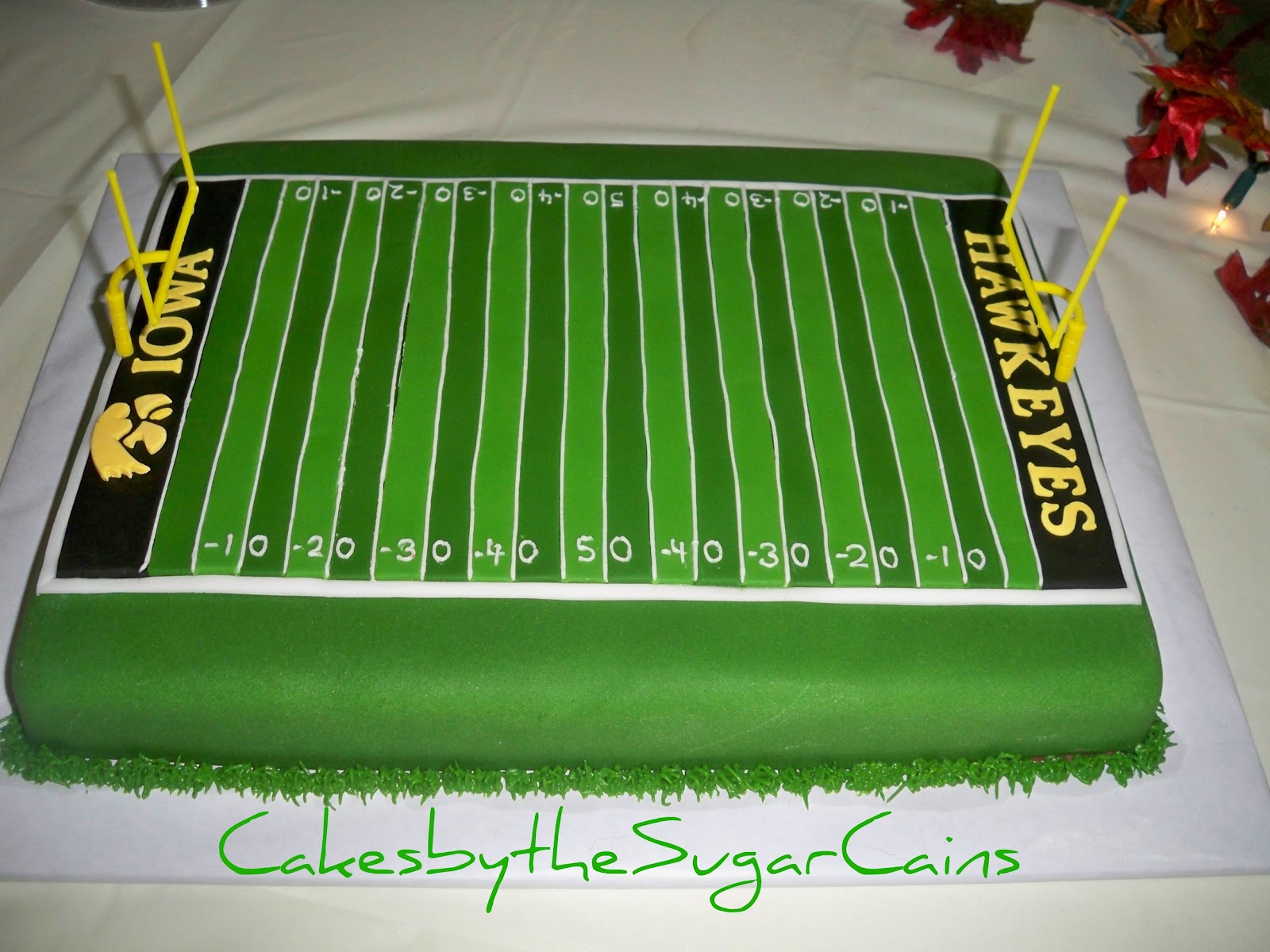 Cakes by the Sugar Cains: Flowered Wedding Cake and Hawkeyes Groom Cake