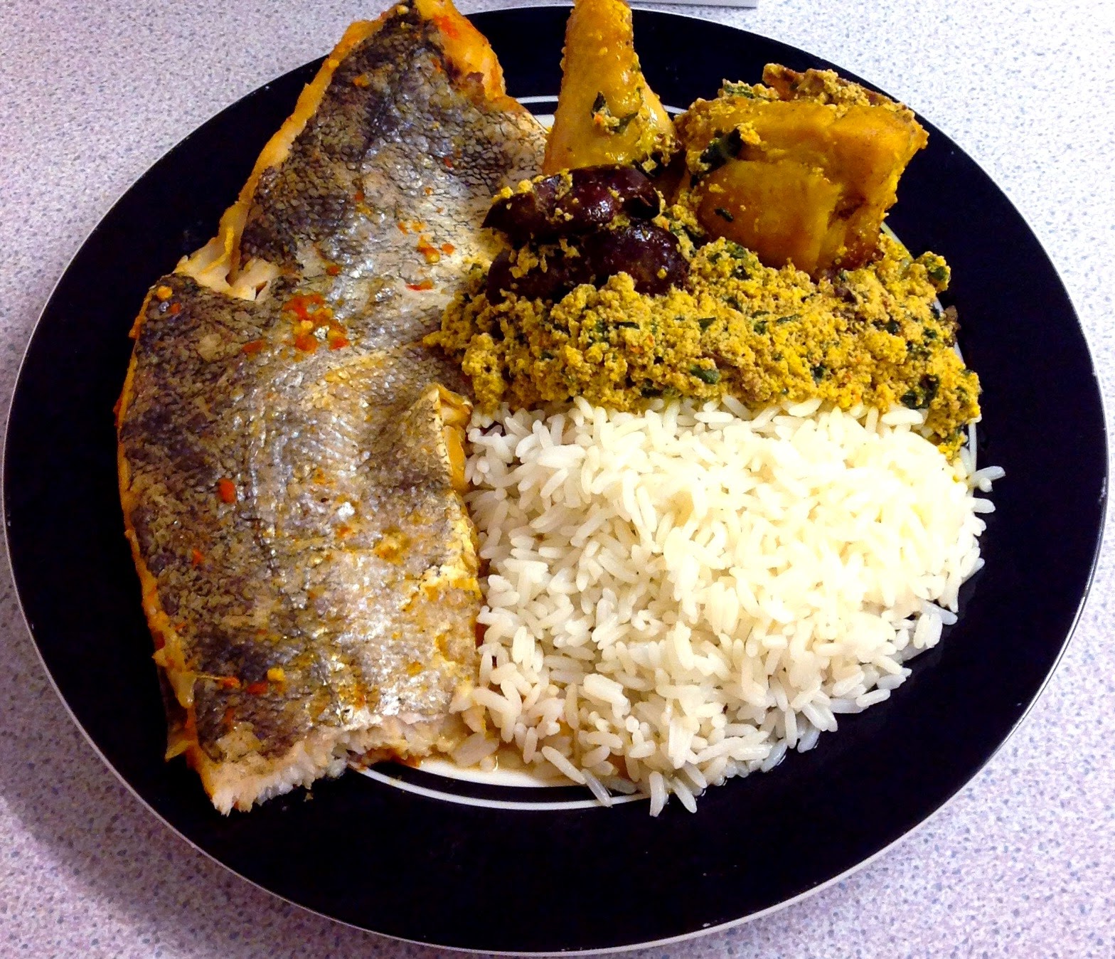 Egusi Soup with White Rice and Hake Fish