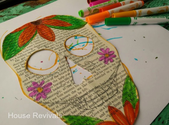 Color in the flowers and mouth. Add decorative borders to the eye ...