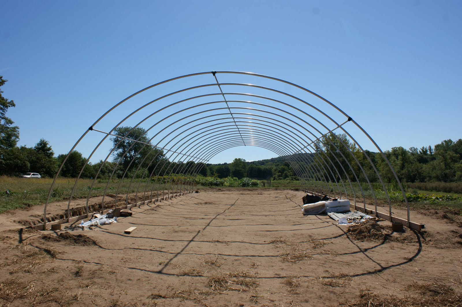 First Bloom Farm: The Metal "Rainbow": the High Tunnel is Framed!