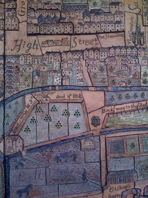 Alicia Merrett: Ceramic plaque of Wells - closer up. A combination of a ...