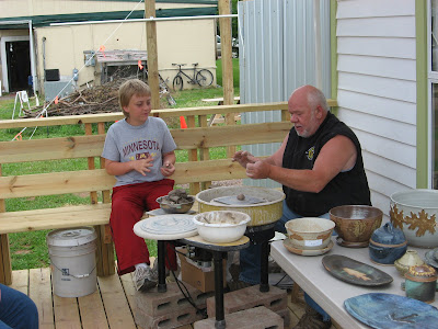 Gallery logo: Peggy and Brian Lundberg pottery demo