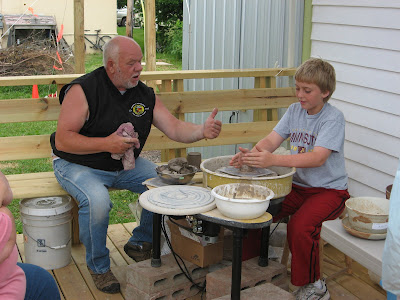 Gallery logo: Peggy and Brian Lundberg pottery demo
