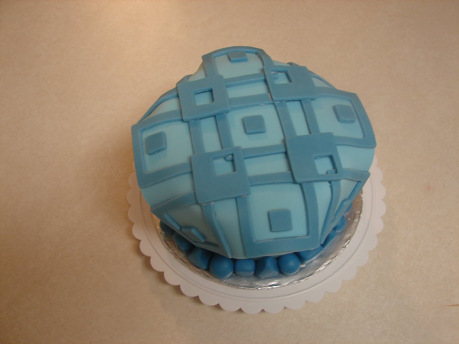 Sweetly Done: Blue Geometric Shapes and cake