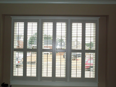 Louisville Blinds and Drapery: Triple window of shutters