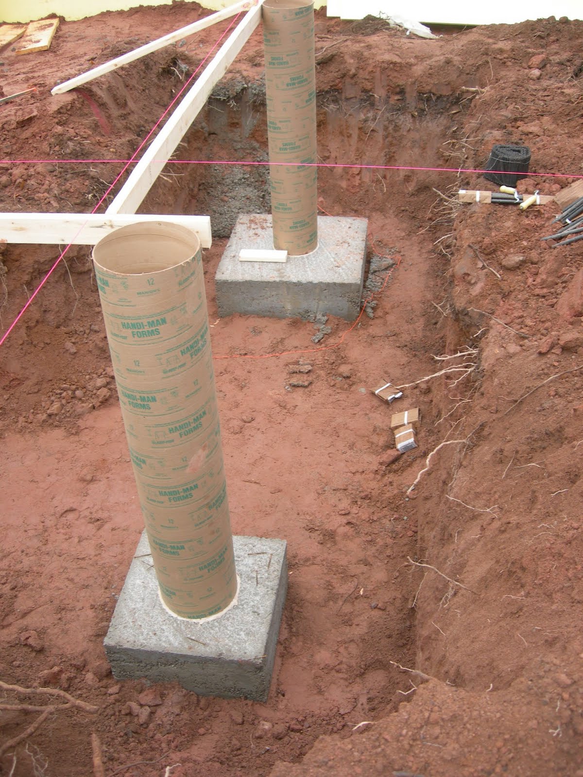 Apostle Highlands Home: Setting the porch and deck piers