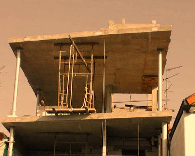 FLAT PLATE SYSTEM HAVING STEEL/ CONCRETE COLUMN