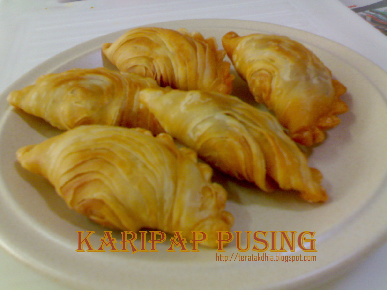 Yuslindhia Zamani: Karipap Pusing