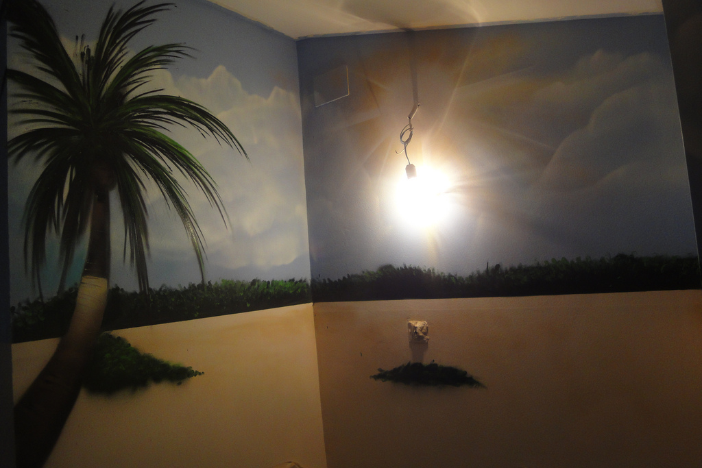 Mural de Goofy y Pato Donald en la playa