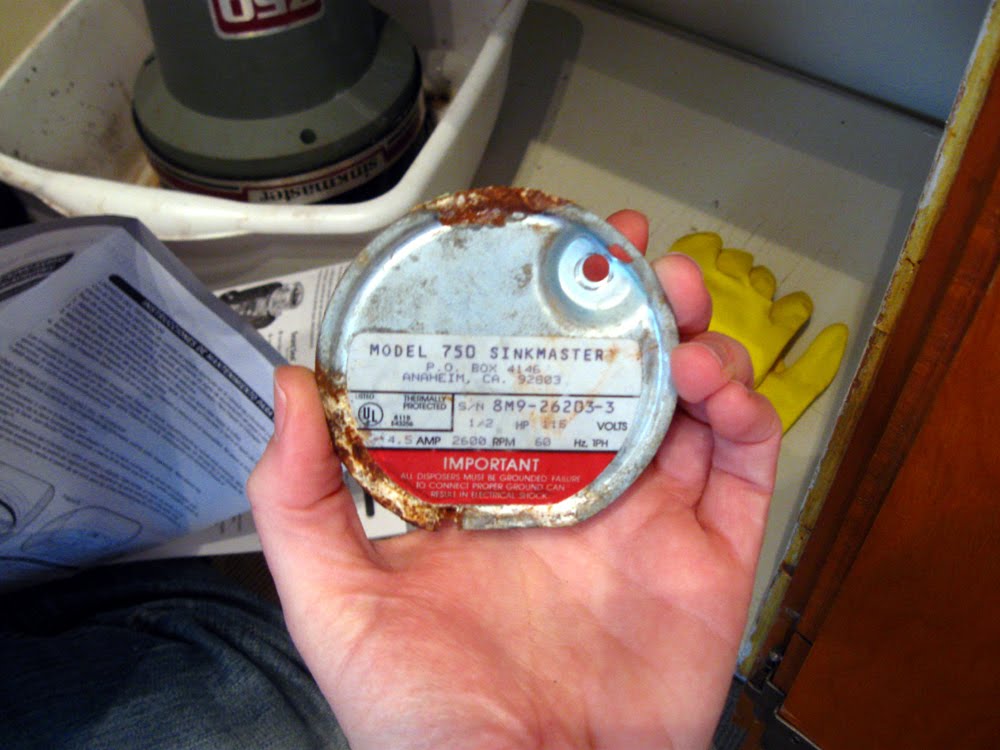 Just a girl with a hammer: The new garbage disposal!