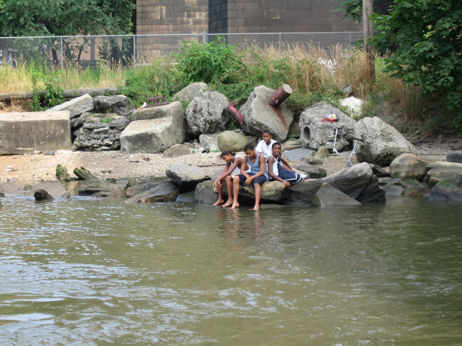 Kids Swimming In A River