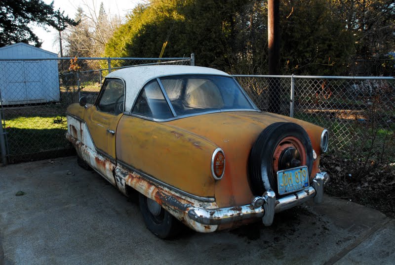 OLD PARKED CARS.: 1957 Nash Metropolitan Series III Hardtop.
