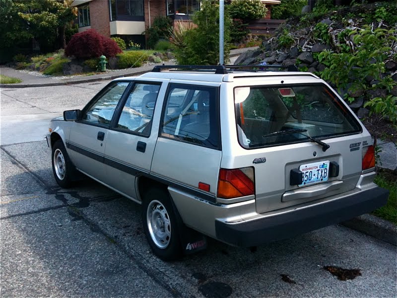 OLD PARKED CARS.: 1989 Imported for Dodge Colt DL 4WD Wagon.