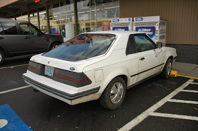 OLD PARKED CARS.: 1984 Ford EXP.