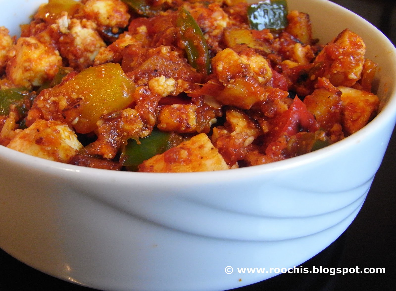 a semi gravy made with paneer and bell peppers tomato is pureed to get ...