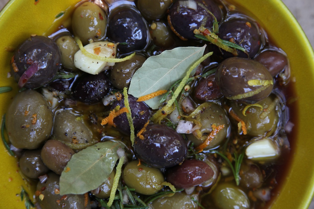 dollop: {nibble} warm marinated olives