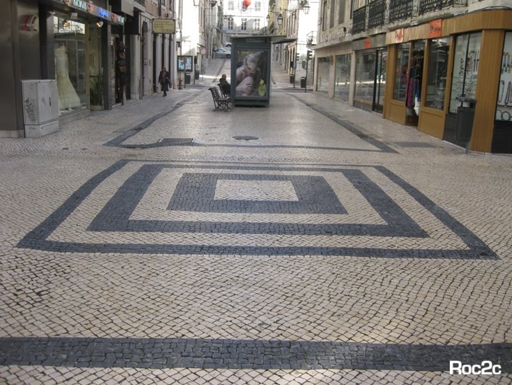 Square design in black and white pavement