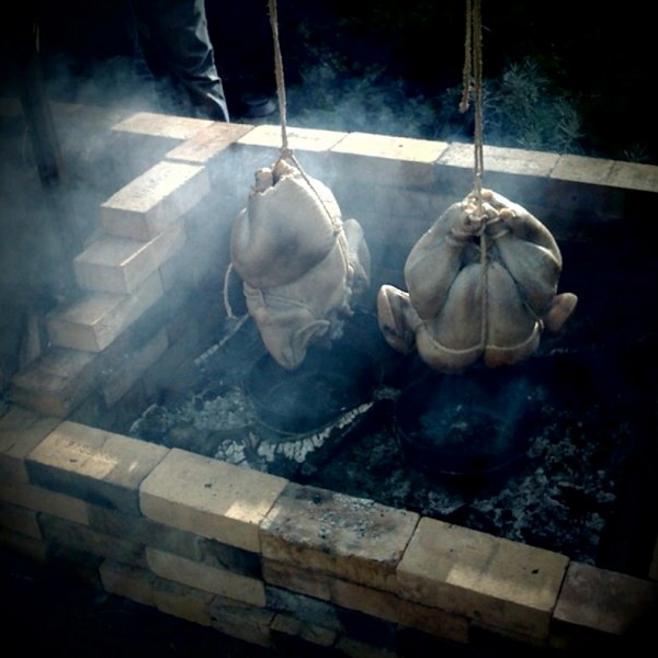 Turkeys roasting over an open fire | The Potter's Kitchen