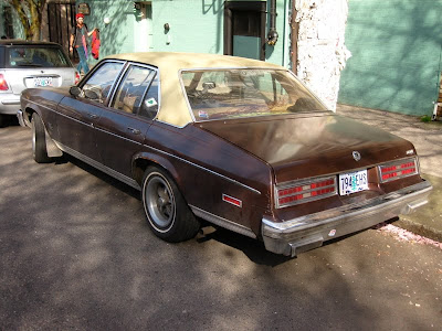 OLD PARKED CARS.: 1979 Pontiac Phoenix Sedan.