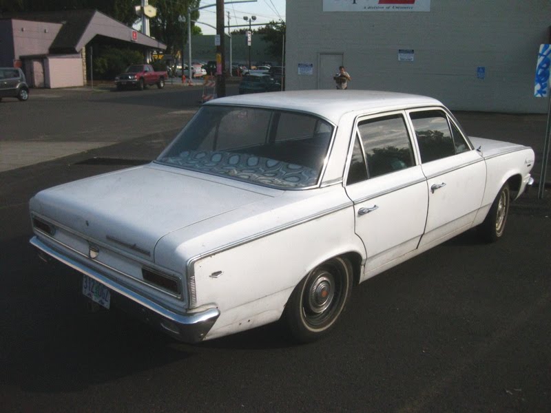 OLD PARKED CARS.: 1966 Rambler American 440 Sedan.