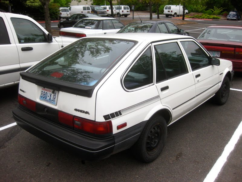 OLD PARKED CARS.: 1986 Chevrolet Nova Wagon.