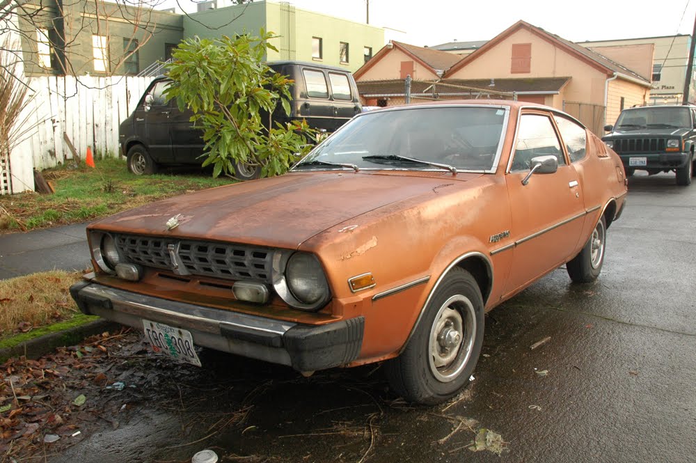 OLD PARKED CARS.: 1977 Plymouth Arrow 160 Hatchback.
