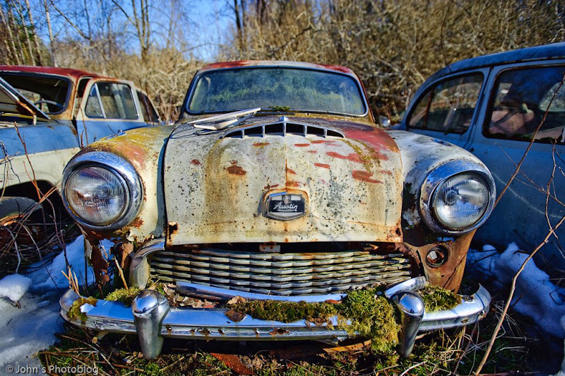 © John`s Photography ©: Old Rusty Cars on a car cemetery # 3 - Båstnäs