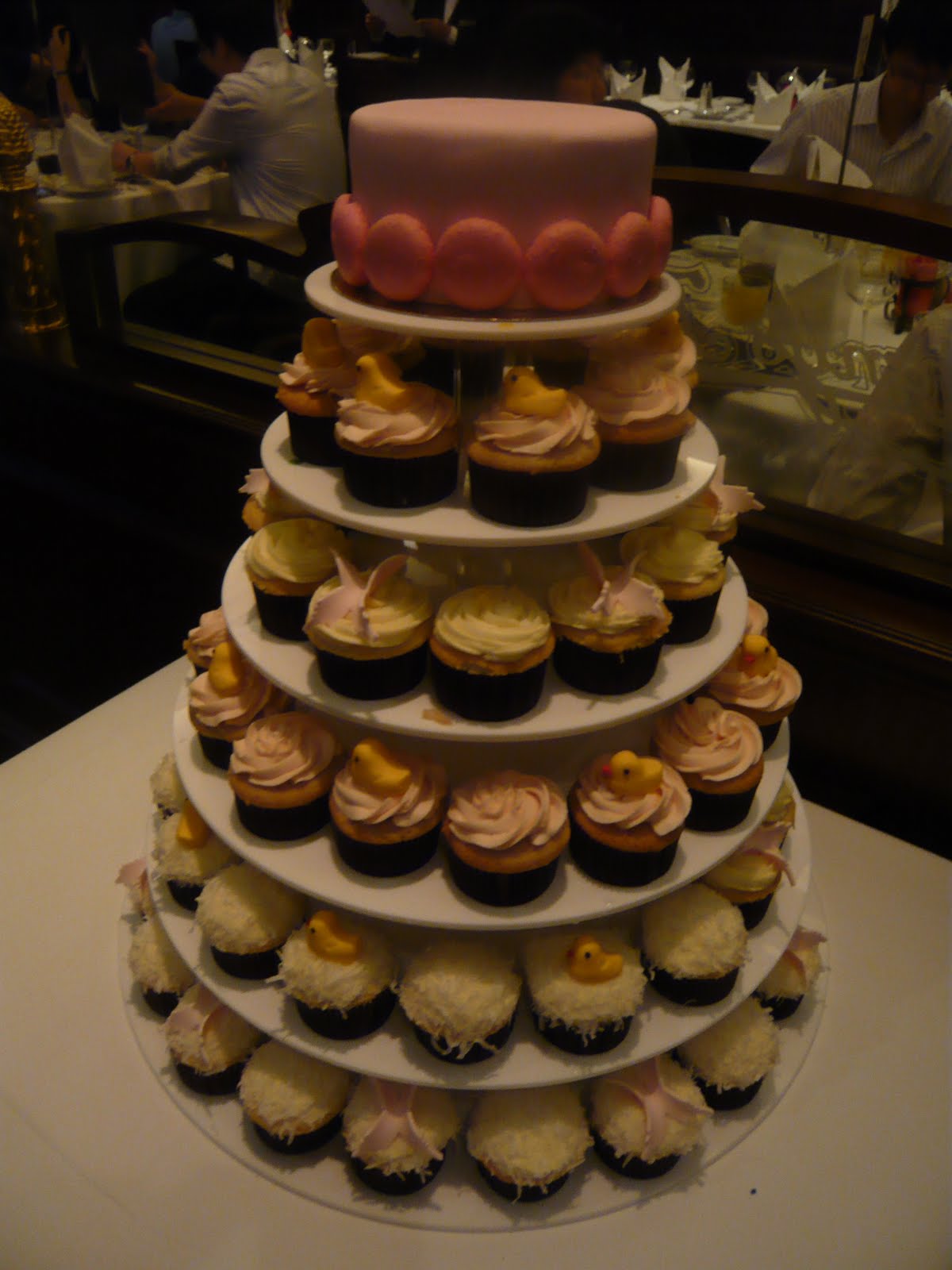 Sift: Pink macaron themed wedding cupcake tower