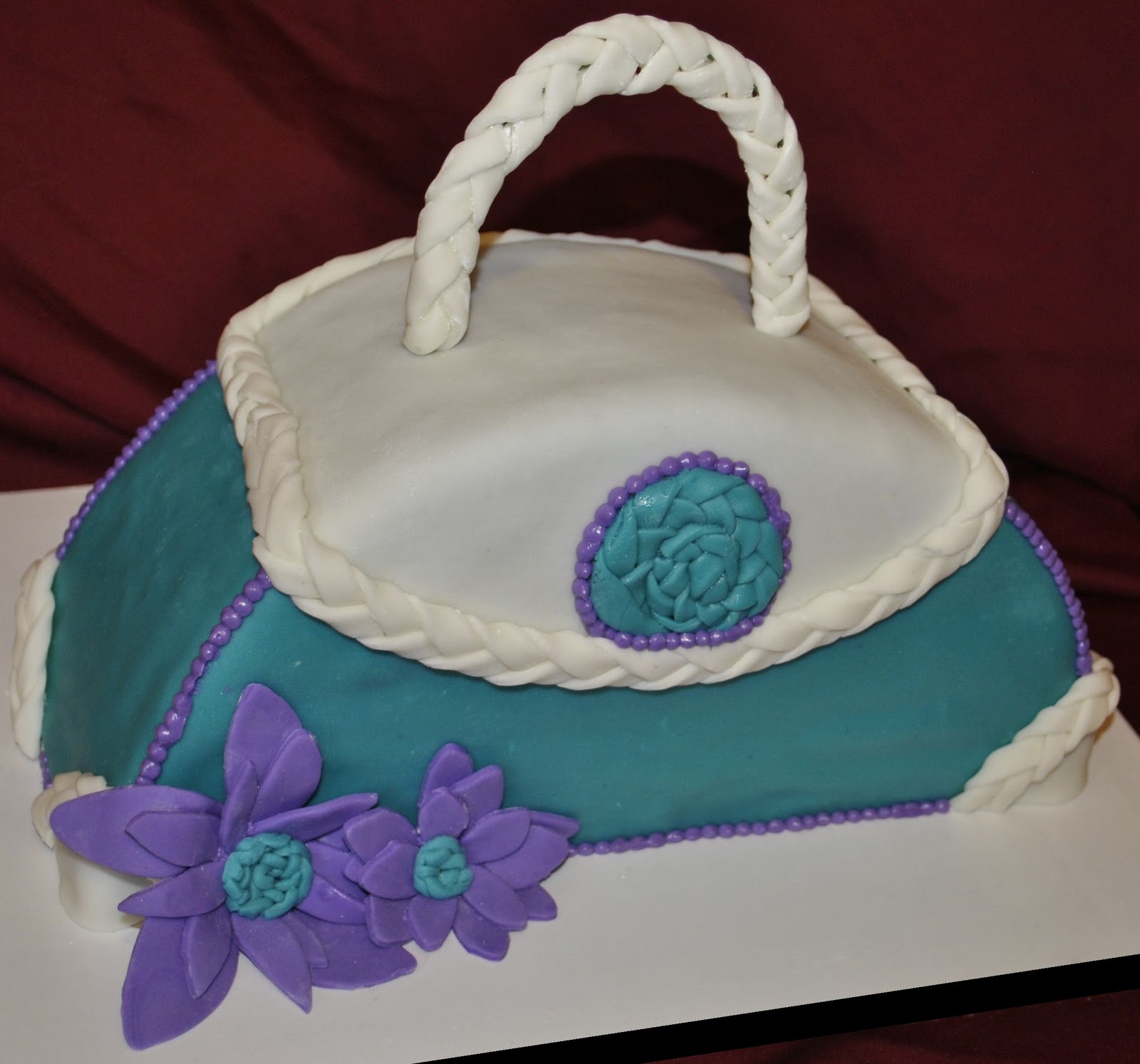 Kaci's Cake Delight: Blue Purse with Flower Embellishments