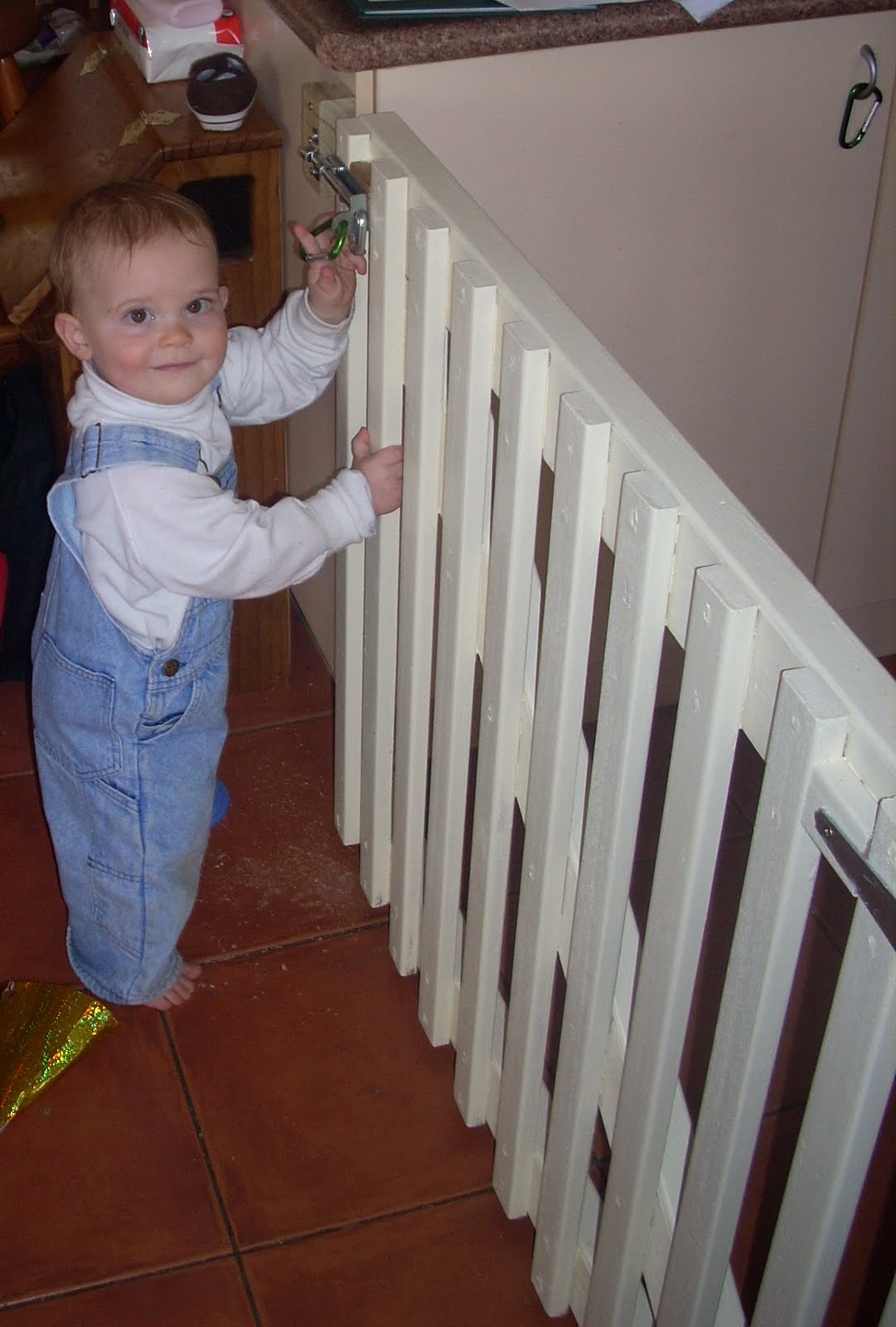 Yelling at the tv: Kid proofing the kitchen with a wooden gate