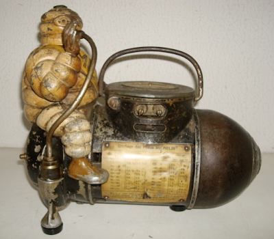 Anonymous Works: 1920's Michelin Man Cast-Iron Air Compressor