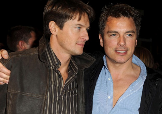 gay spy: John Barrowman with his partner Scott Gill