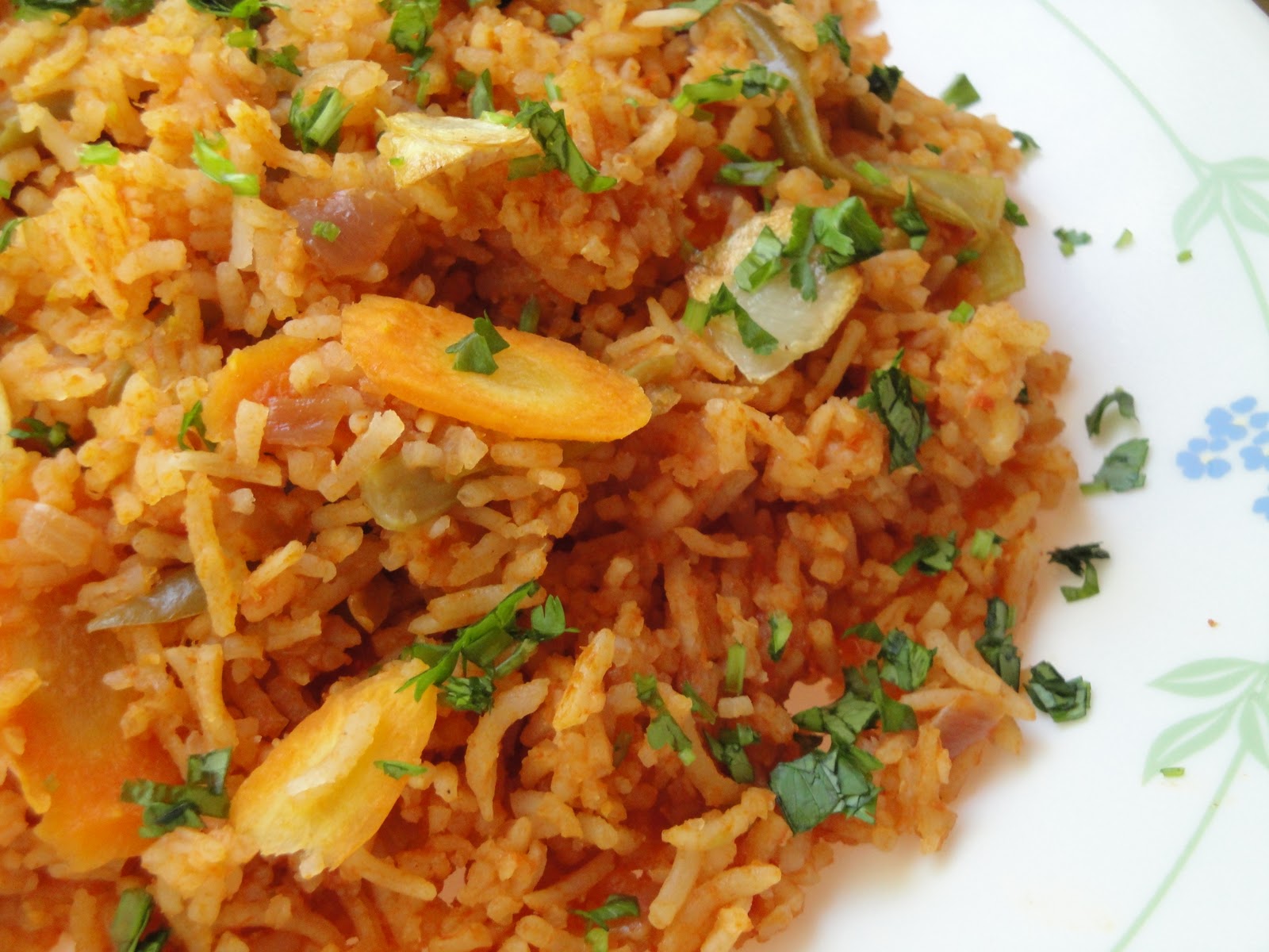 cumin and cardamom: Jollof Rice ( Ghanaian )
