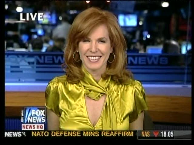 Five Celebrity Magazines: liz claman - yellow satin bow blouse