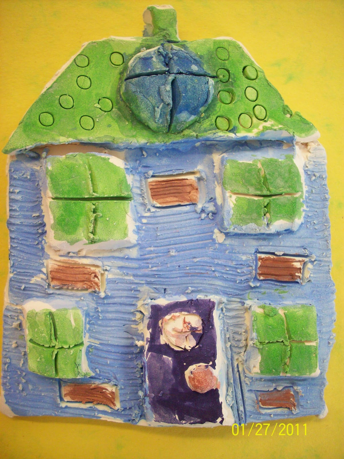 Center School Art: Clay Houses by Grade 4
