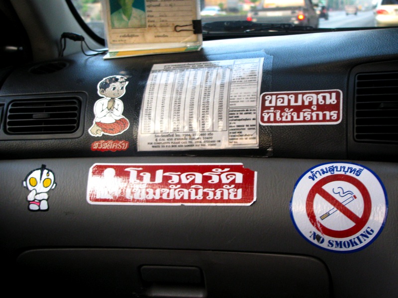 Still Life in Moving Vehicles: Taxi Stickers