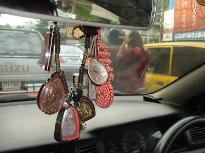 Still Life in Moving Vehicles: Thai Amulets