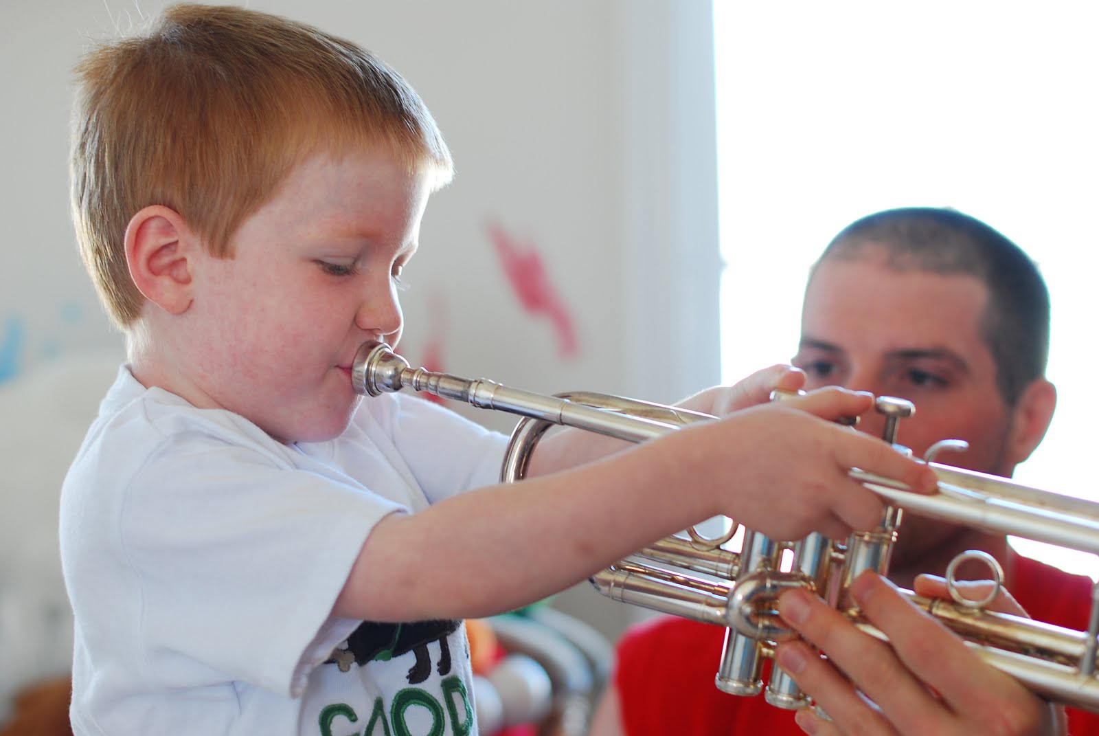 Semenick family: Learning to play the trumpet