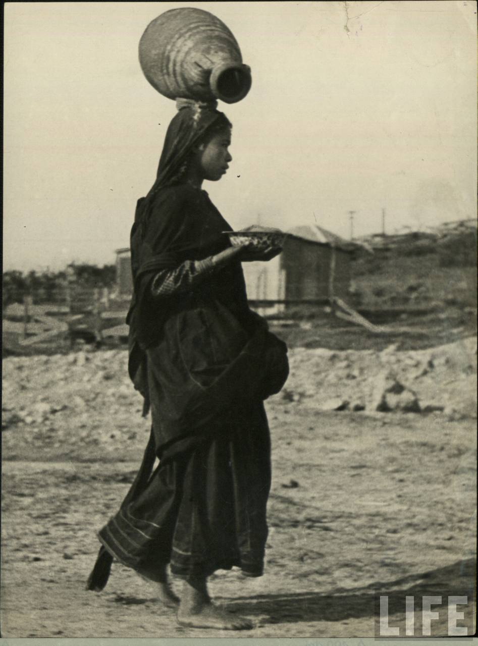 Indian Woman Carrying a Pot - Old Indian Photos
