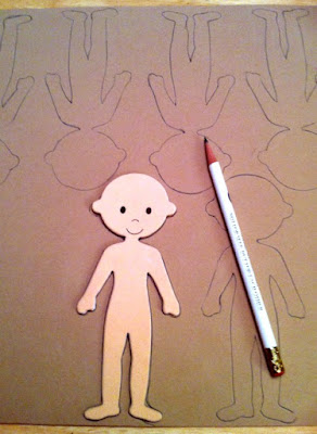 I traced around the little foam people cut-outs to make more people.