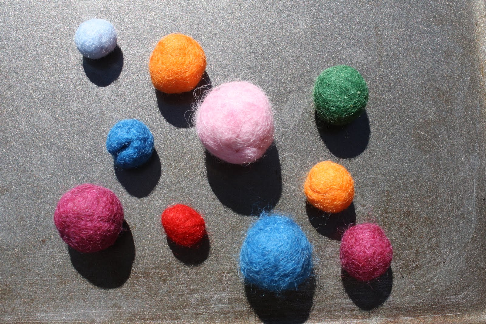 How The Sun Rose: colorful felt acorns